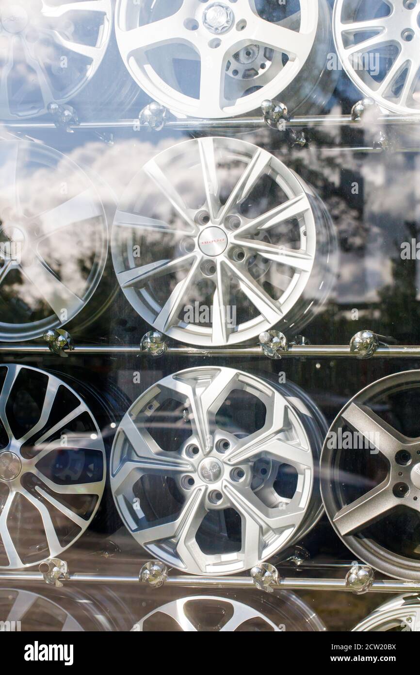 Russia Vyborg. 09.09.2020 Car rims in the shop window behind the glass ...