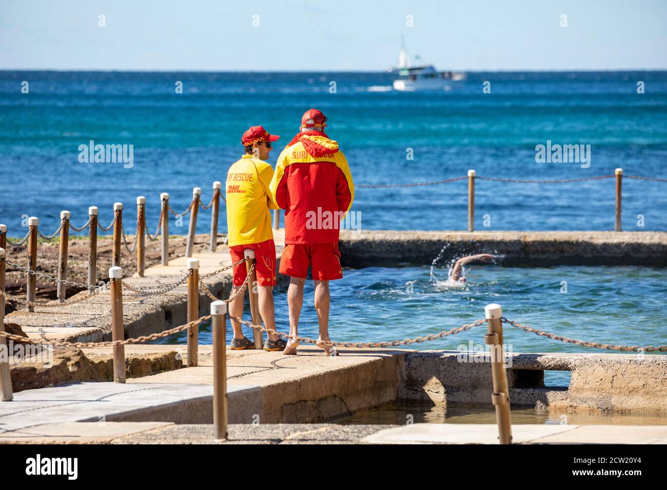 Australian volunteer lifeguards surf rescue personnel beside a beach ...