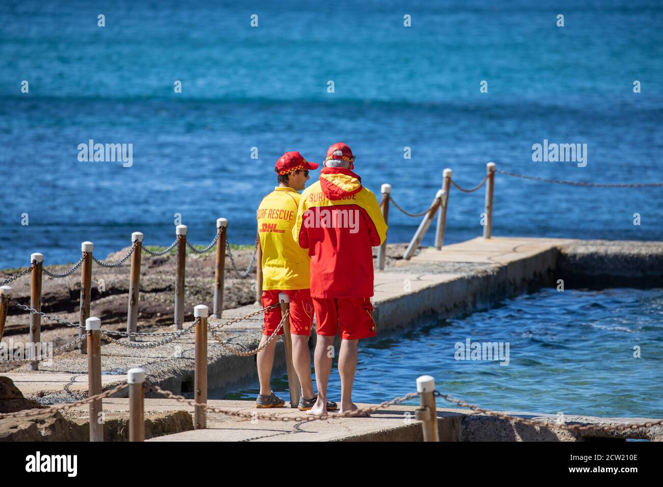Australian volunteer lifeguards surf rescue personnel beside a beach ...
