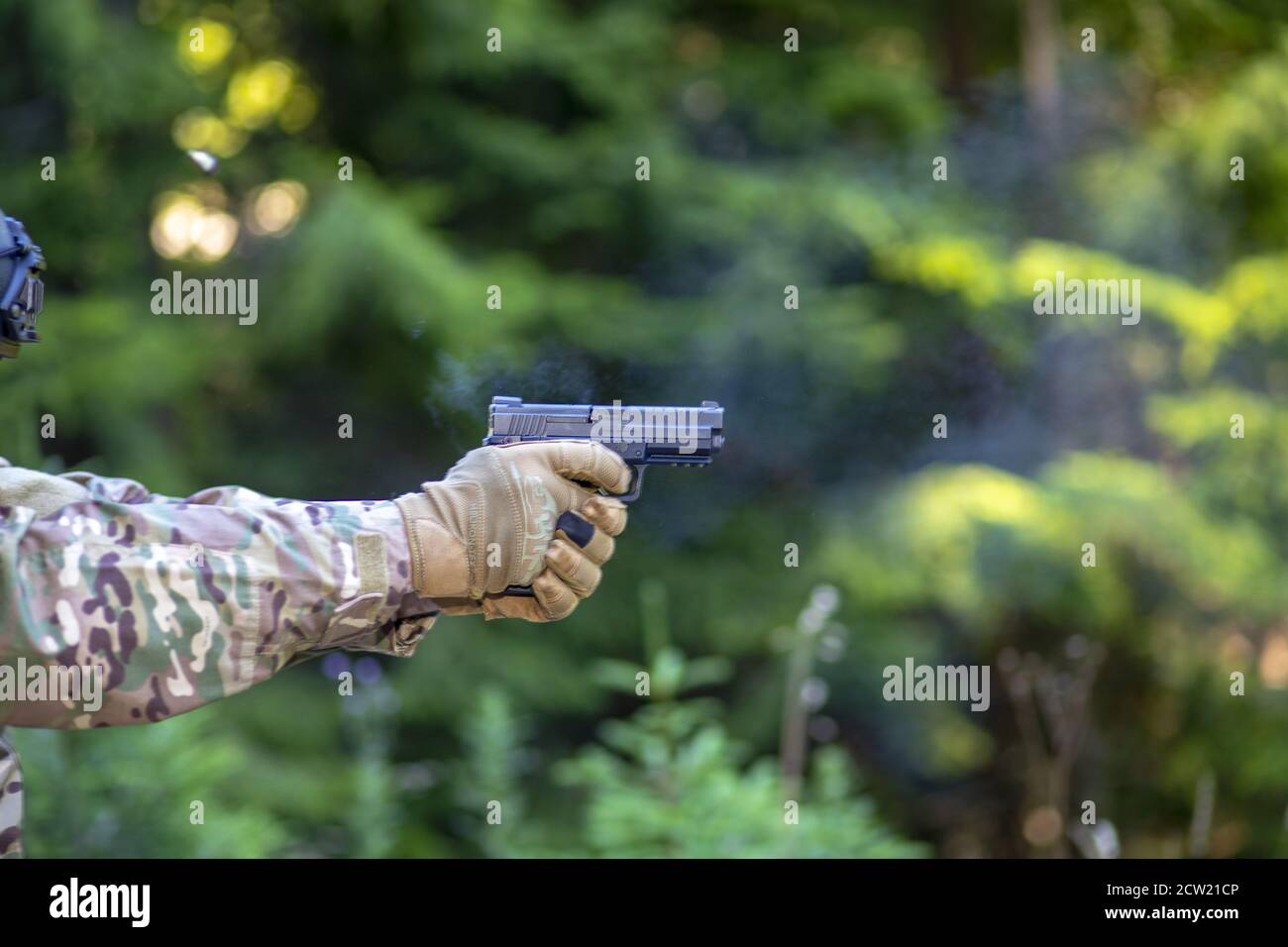 Soldier shooting from the handgun during the military training Stock ...