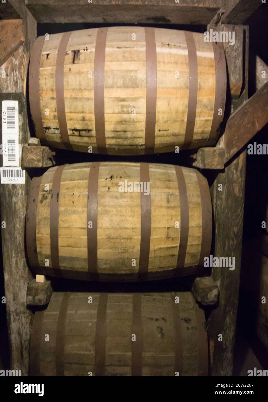 Barrels Stacked Vertically in storage warehouse Stock Photo - Alamy