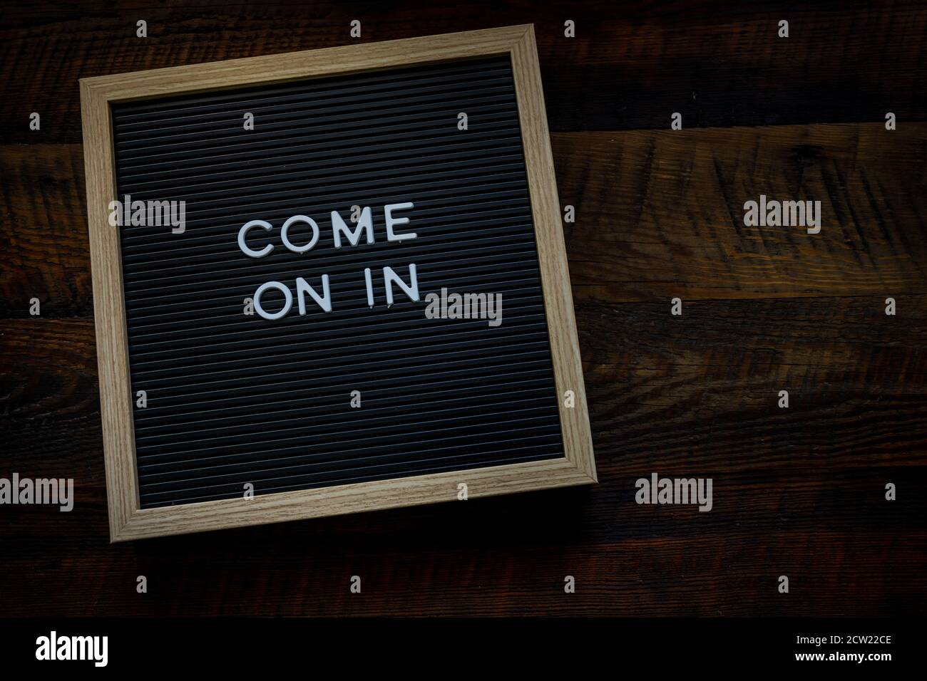 Come On In Sign with Copy Space to right Stock Photo - Alamy