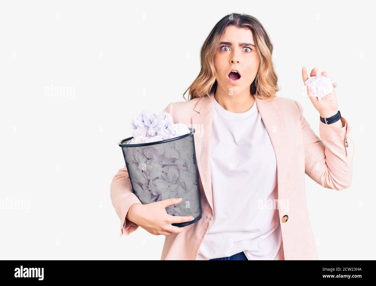 Woman holding papers shocked hi-res stock photography and images - Alamy