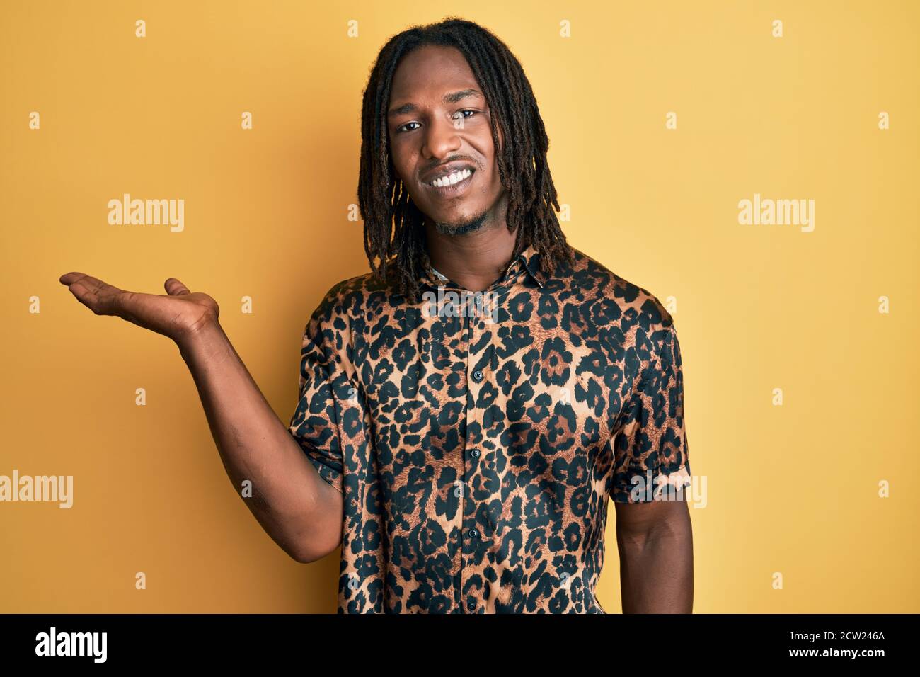 African american man with braids wearing leopard animal print shirt ...