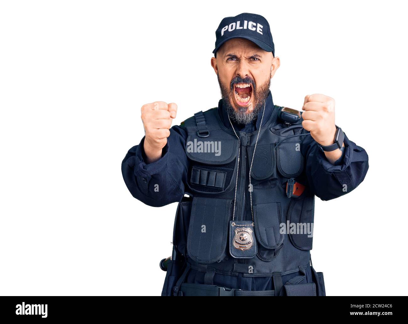 Young handsome man wearing police uniform angry and mad raising fists ...