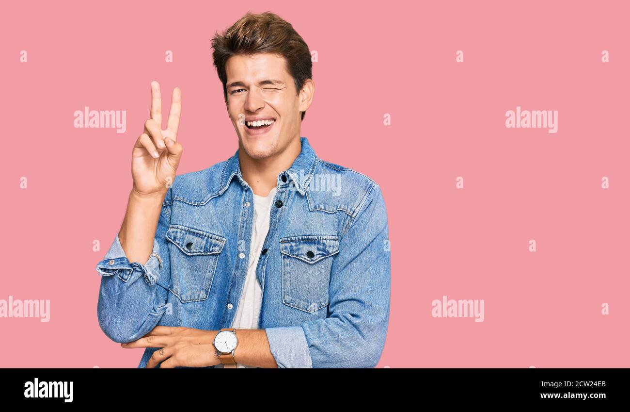 Handsome caucasian man wearing casual denim jacket smiling with happy ...