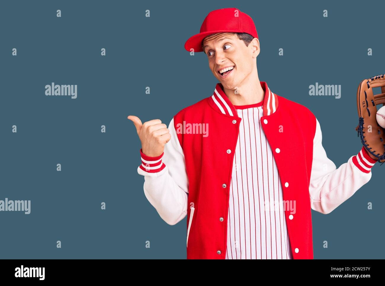 Man wearing glove showing thumbs hi-res stock photography and images ...