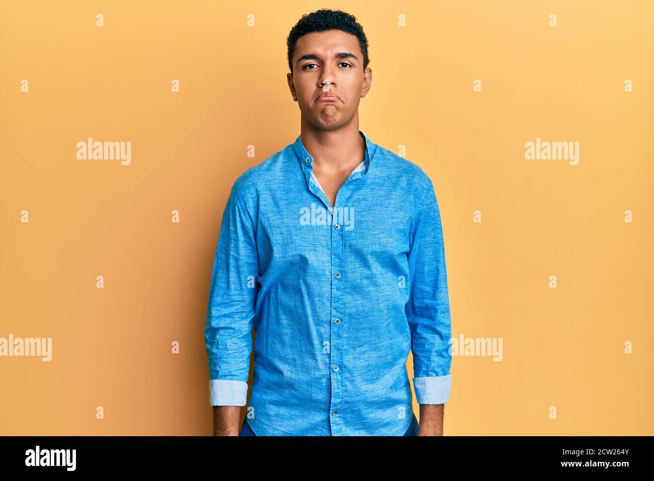 Young arab man wearing casual clothes depressed and worry for distress ...