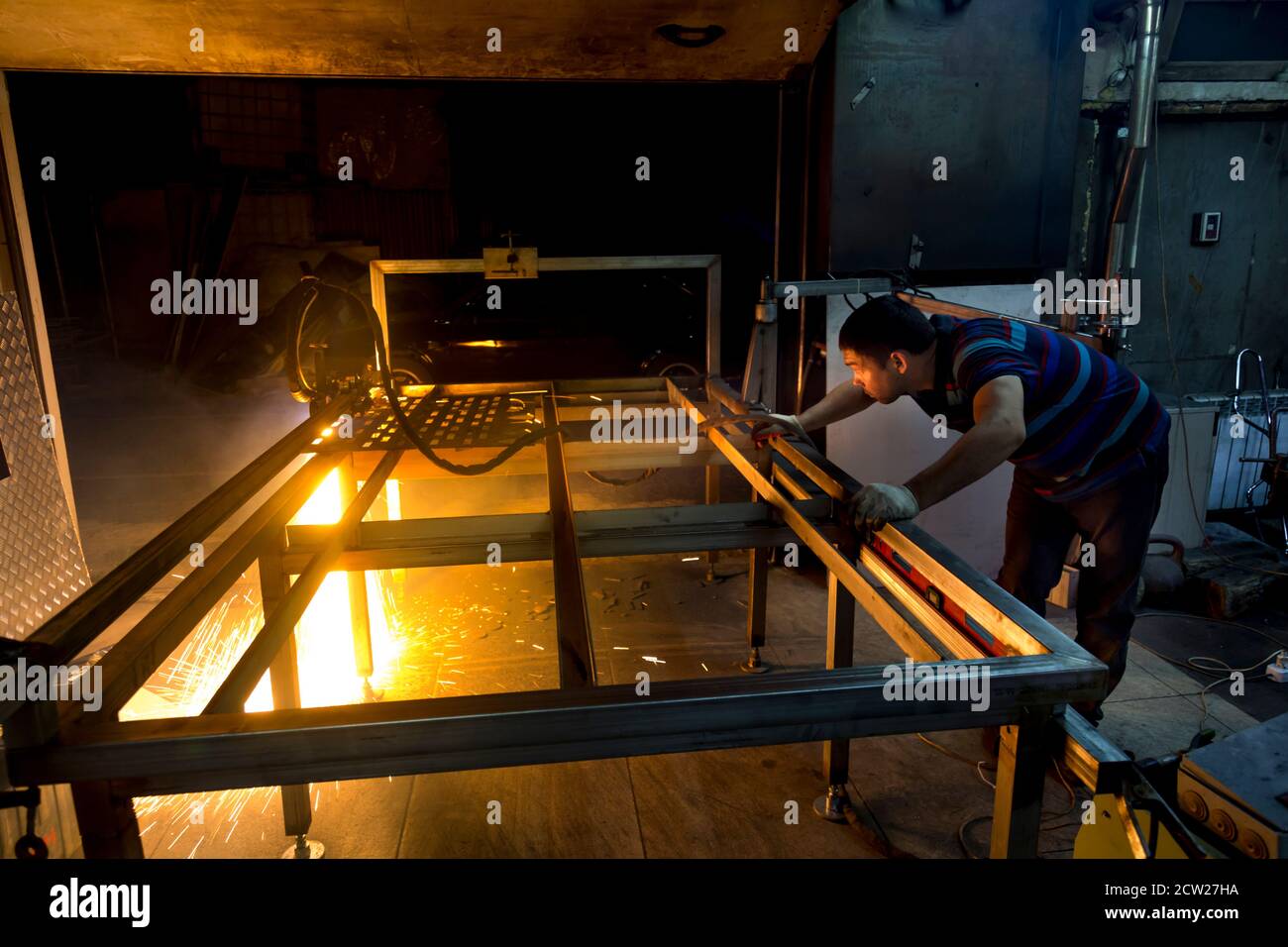 Plasma sheet metal cutting operator on a rack Stock Photo - Alamy