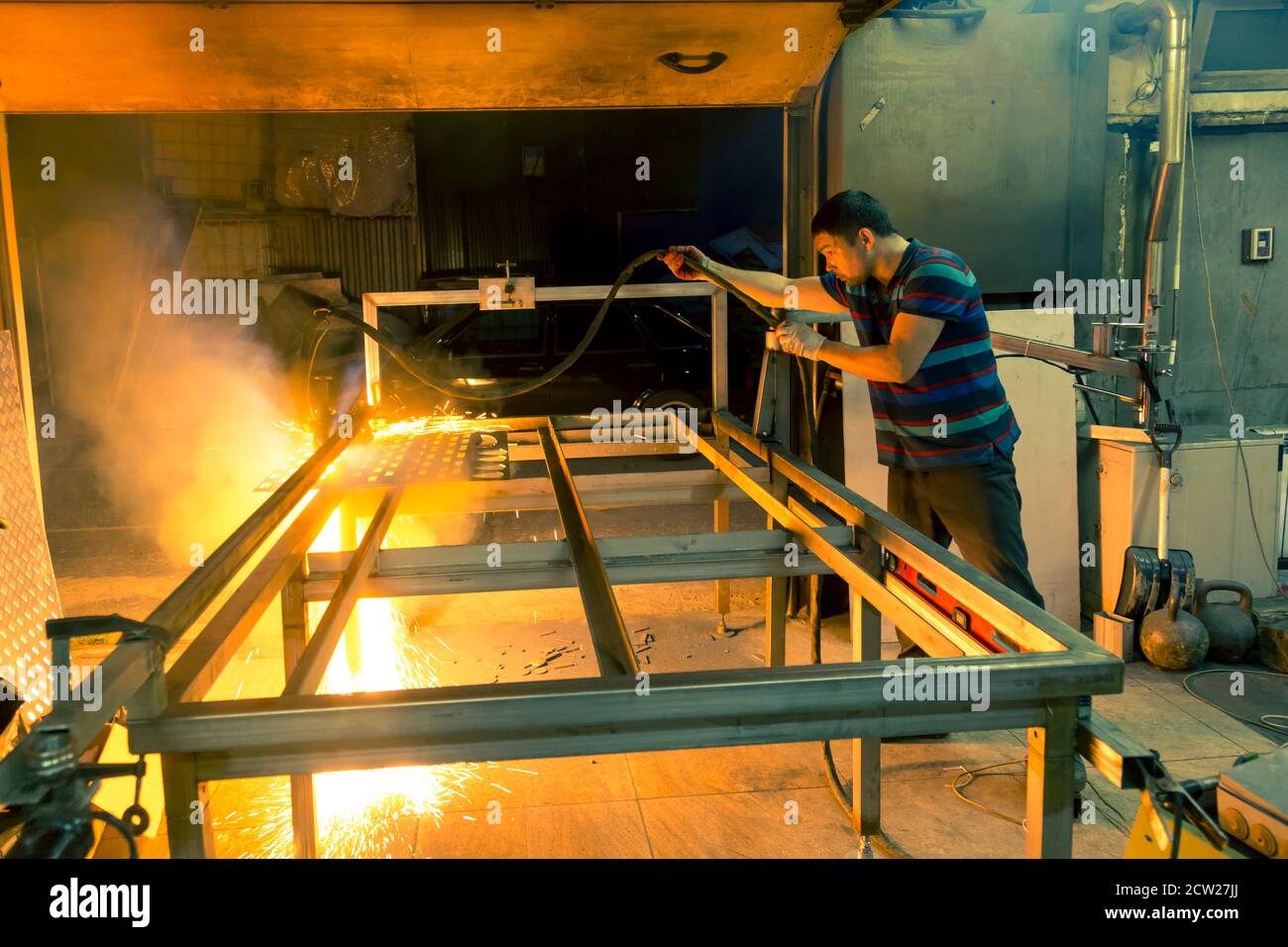 Plasma sheet metal cutting operator on a rack Stock Photo - Alamy