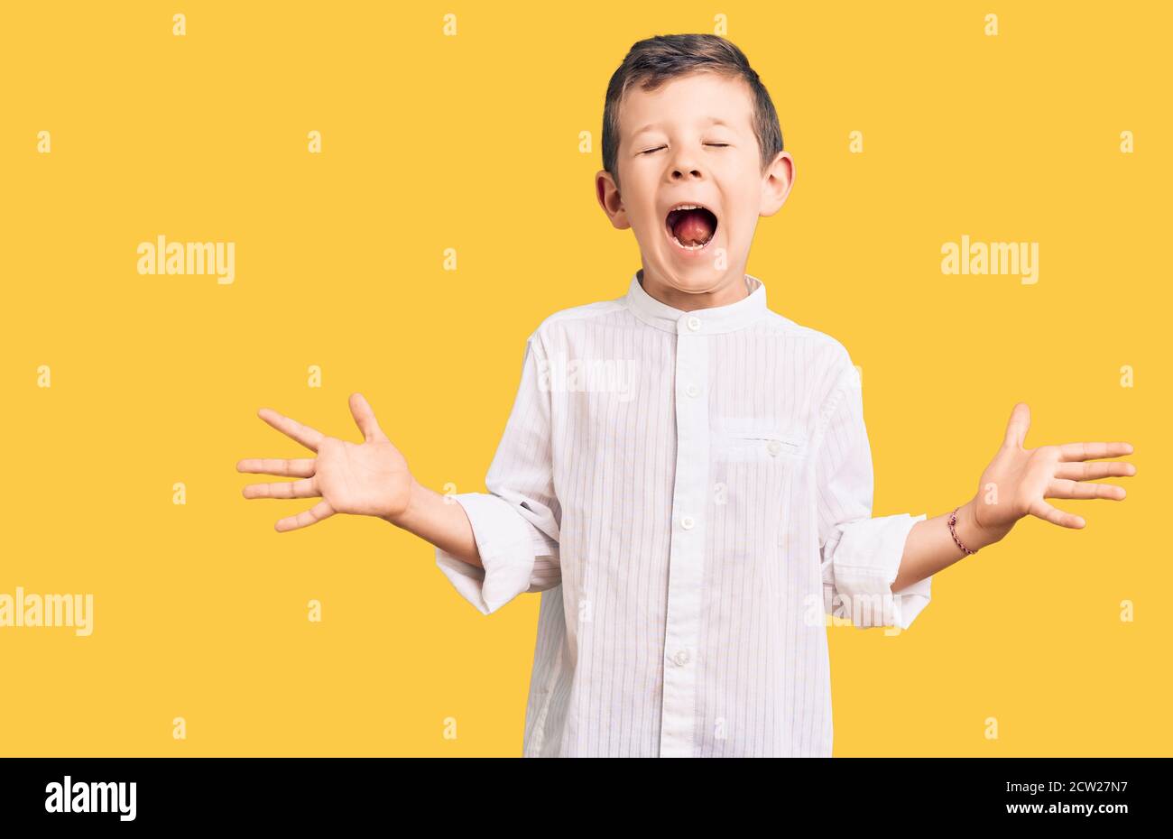 Cute blond kid wearing elegant shirt celebrating mad and crazy for ...