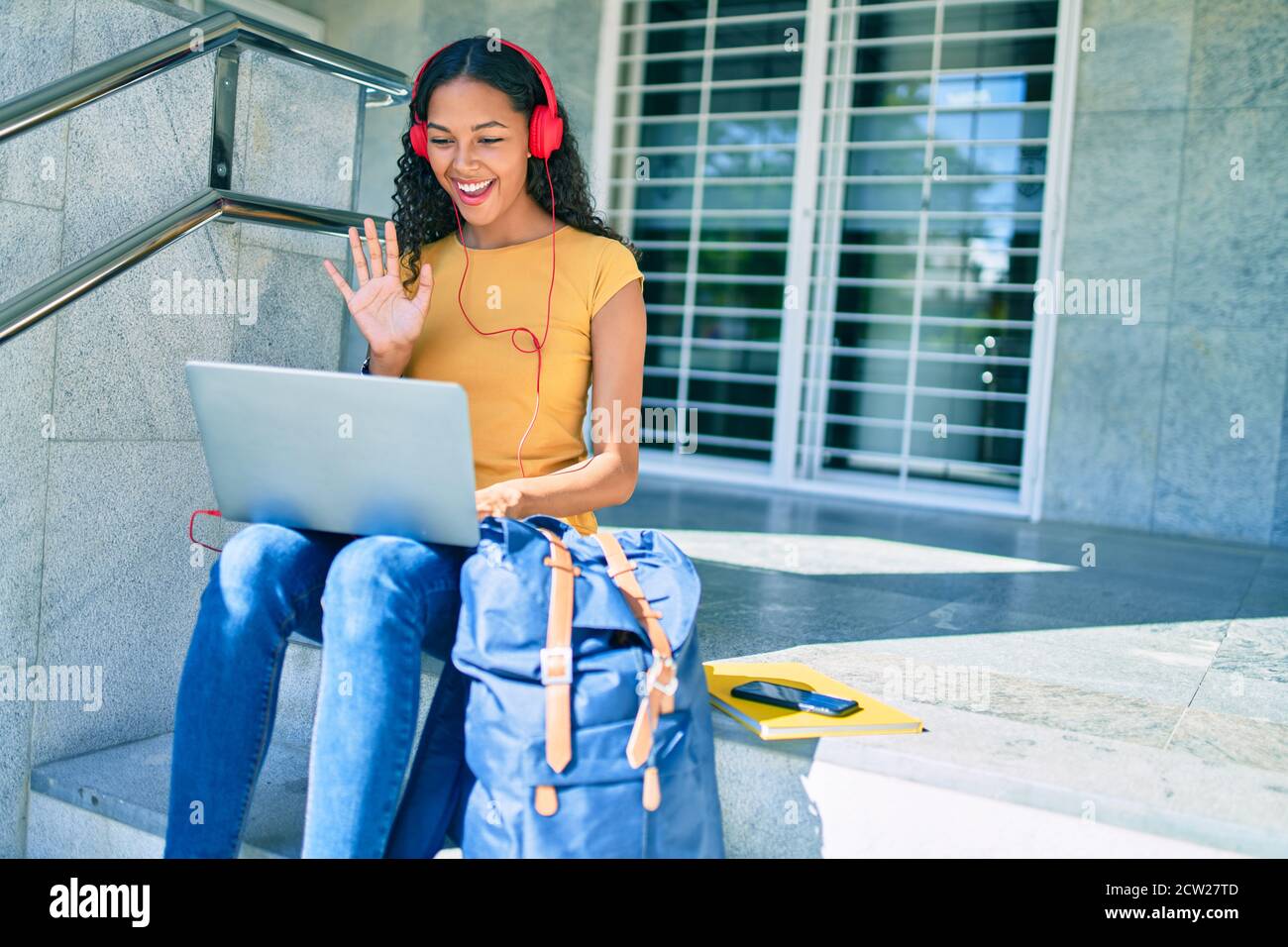 Young african american student girl doing video call using laptop at ...