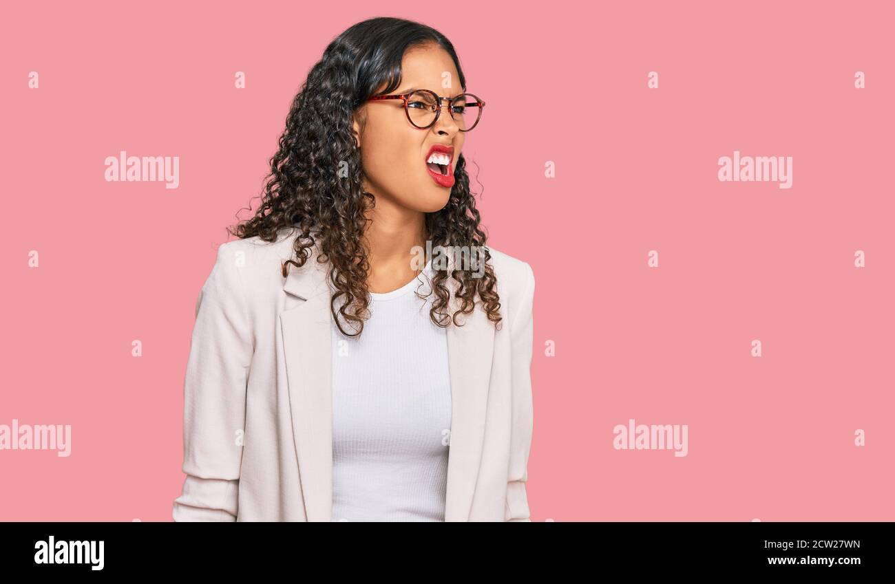 Young african american girl wearing business clothes angry and mad ...