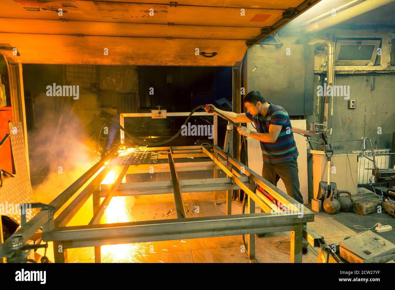 Plasma sheet metal cutting operator on a rack Stock Photo - Alamy