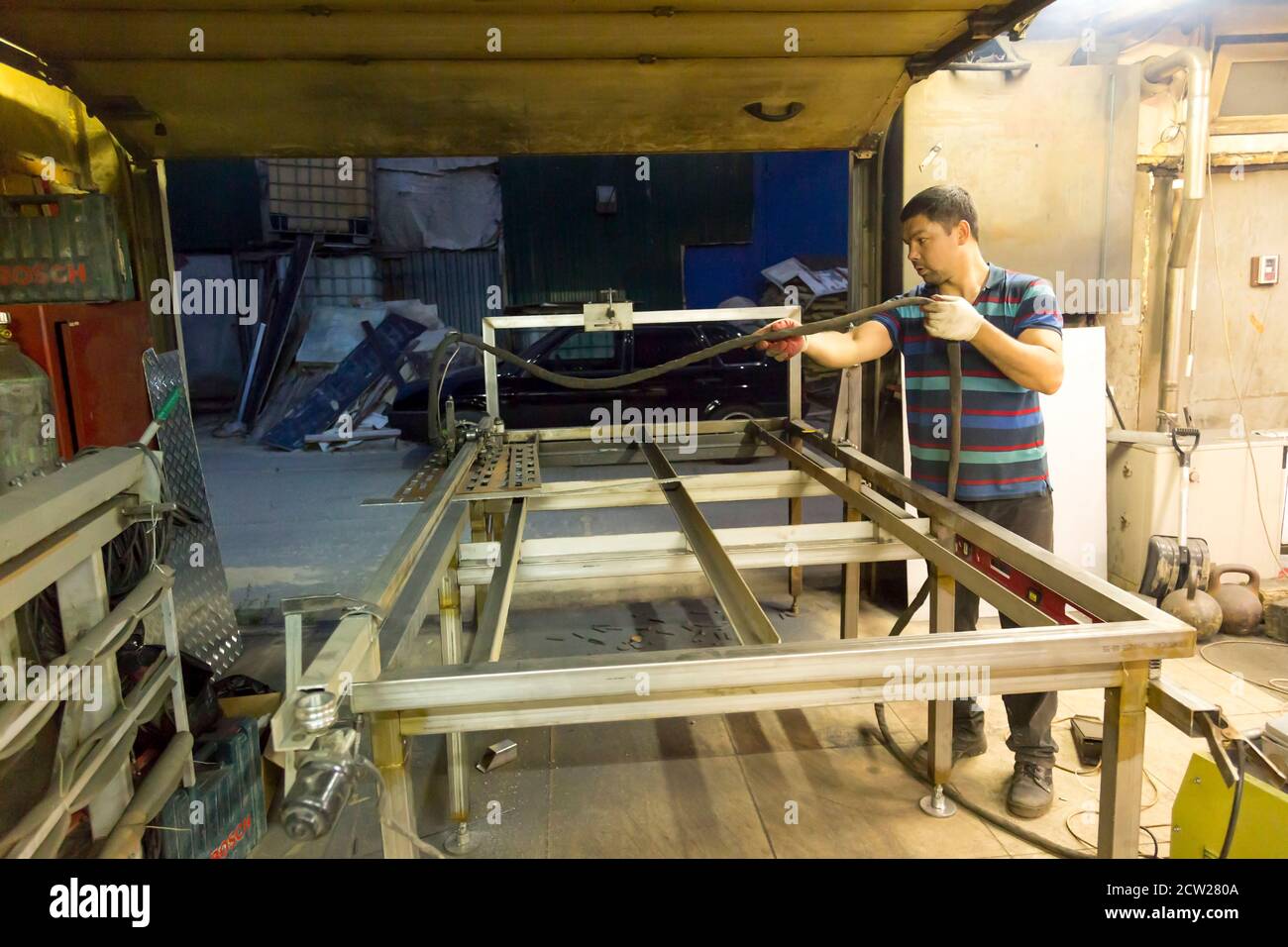 Plasma sheet metal cutting operator on a rack Stock Photo - Alamy