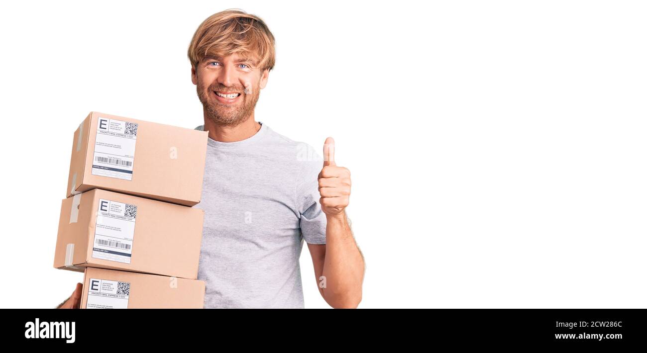 Delivery man thumb up Cut Out Stock Images & Pictures - Alamy