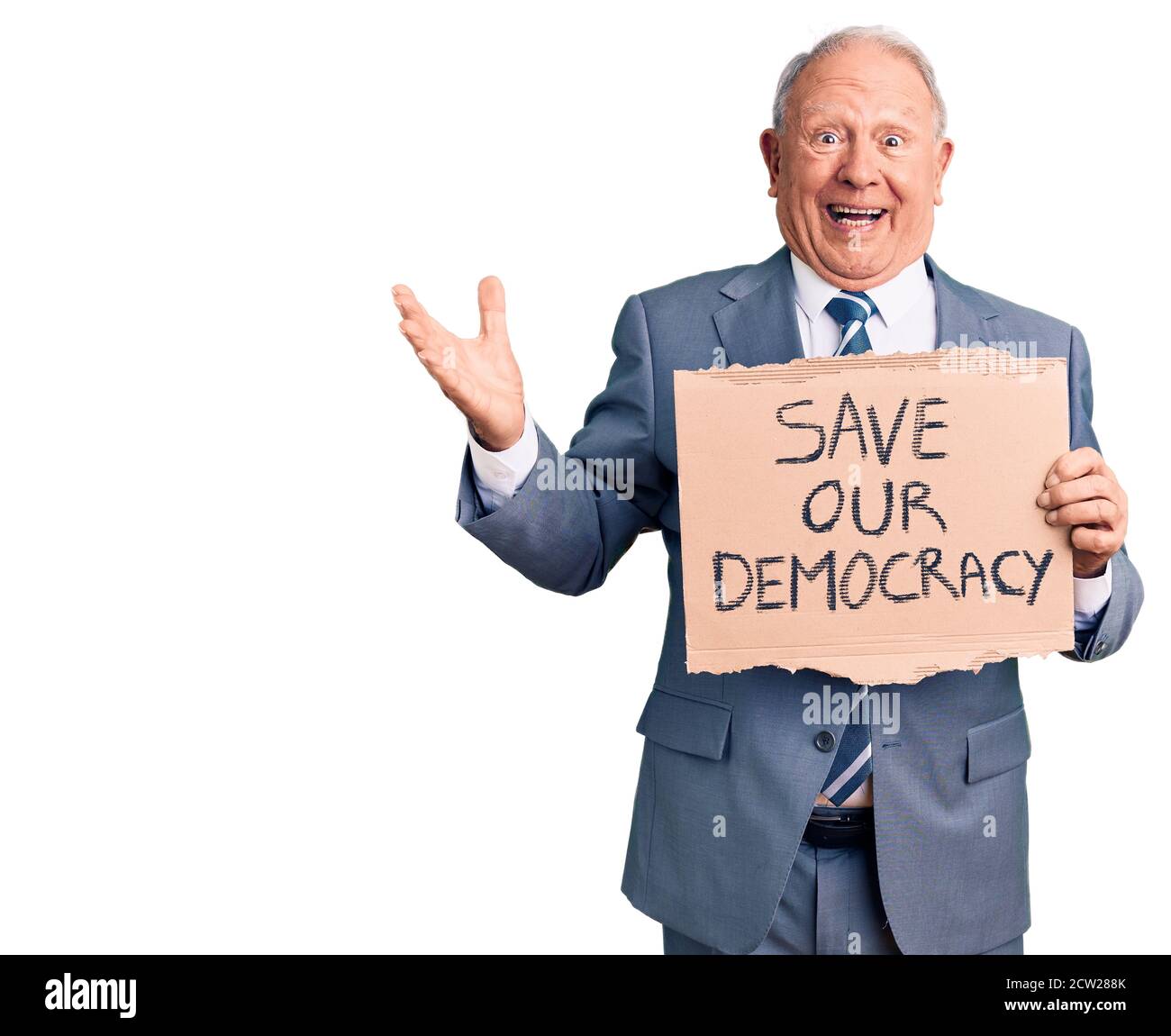 Senior handsome grey-haired man holding save our democracy cardboard ...