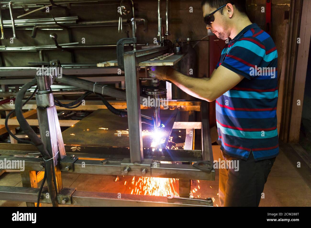 Plasma sheet metal cutting operator on a rack Stock Photo - Alamy