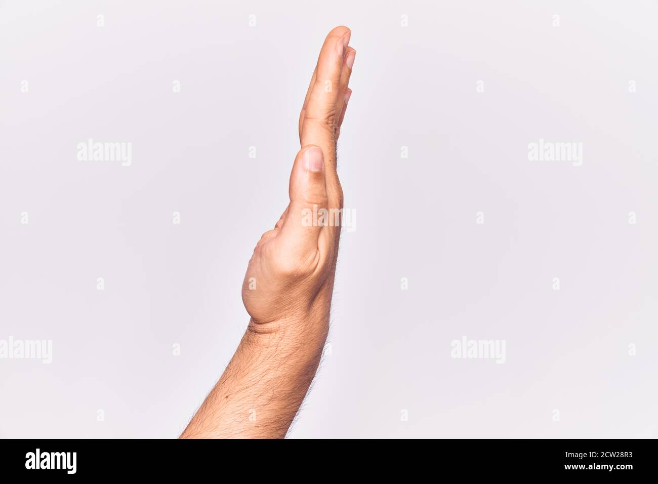 Close up of hand of young caucasian man over isolated background ...