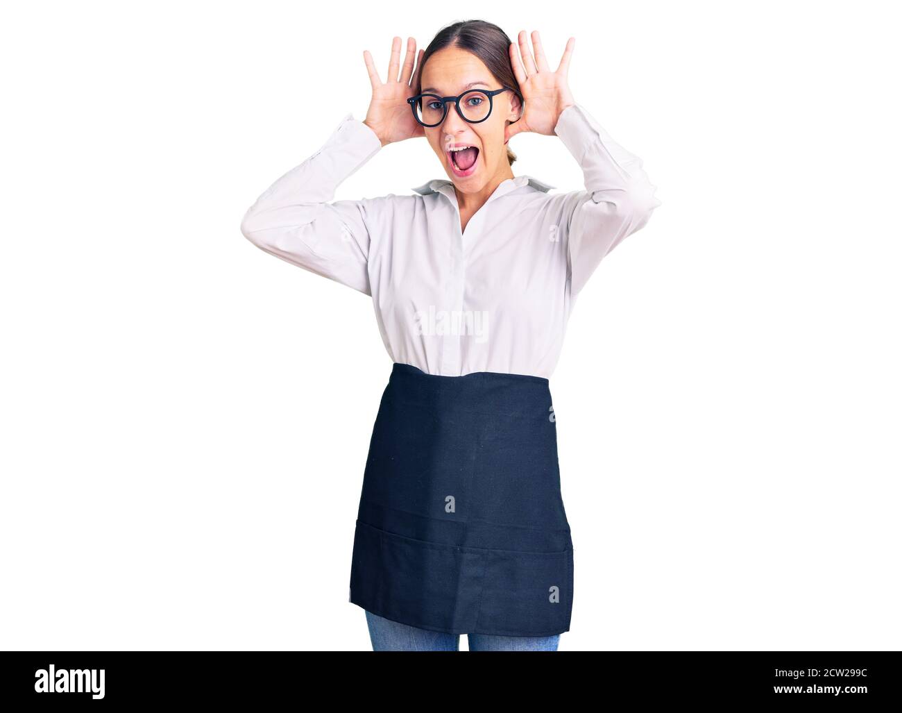 Beautiful brunette young woman wearing professional waitress apron ...