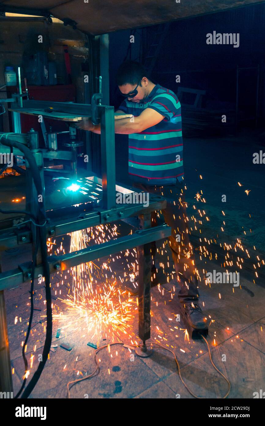 Plasma sheet metal cutting operator on a rack Stock Photo - Alamy