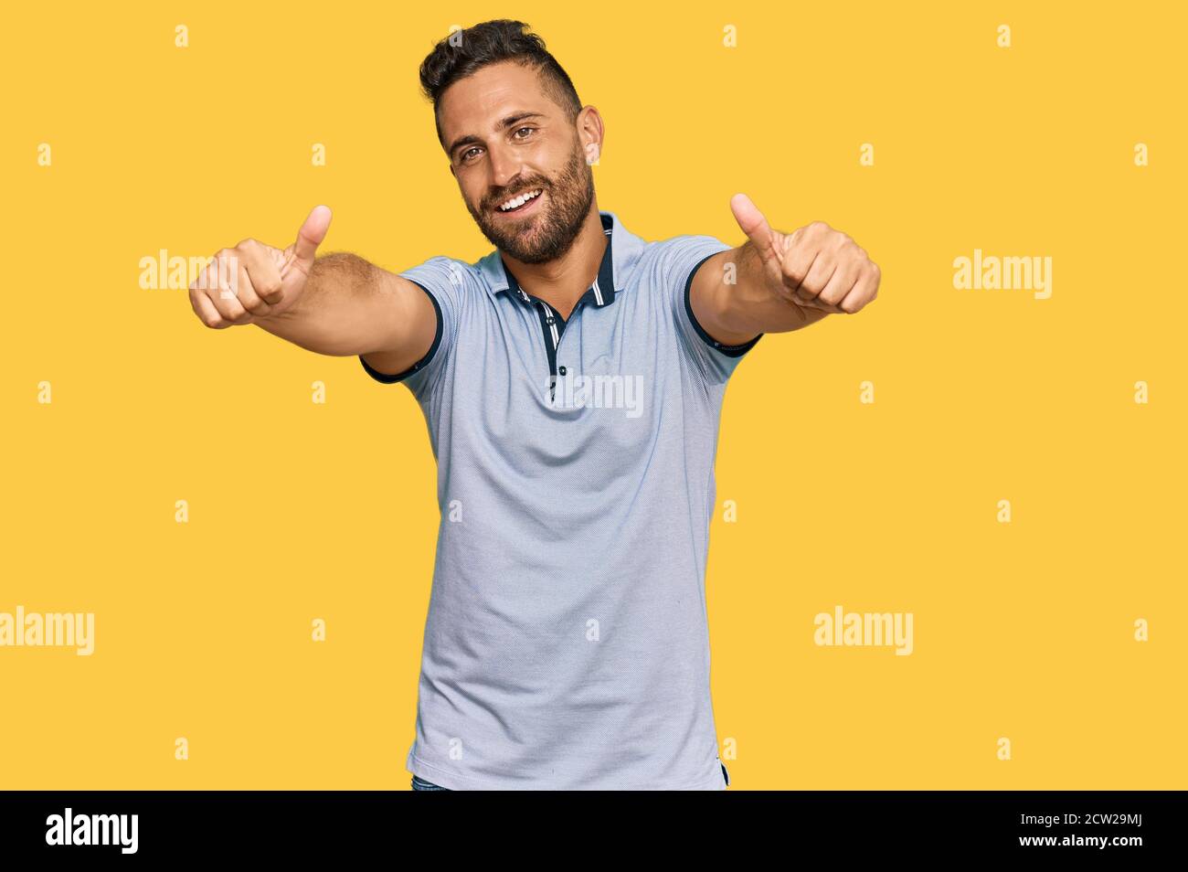 Handsome man with beard wearing casual clothes approving doing positive ...