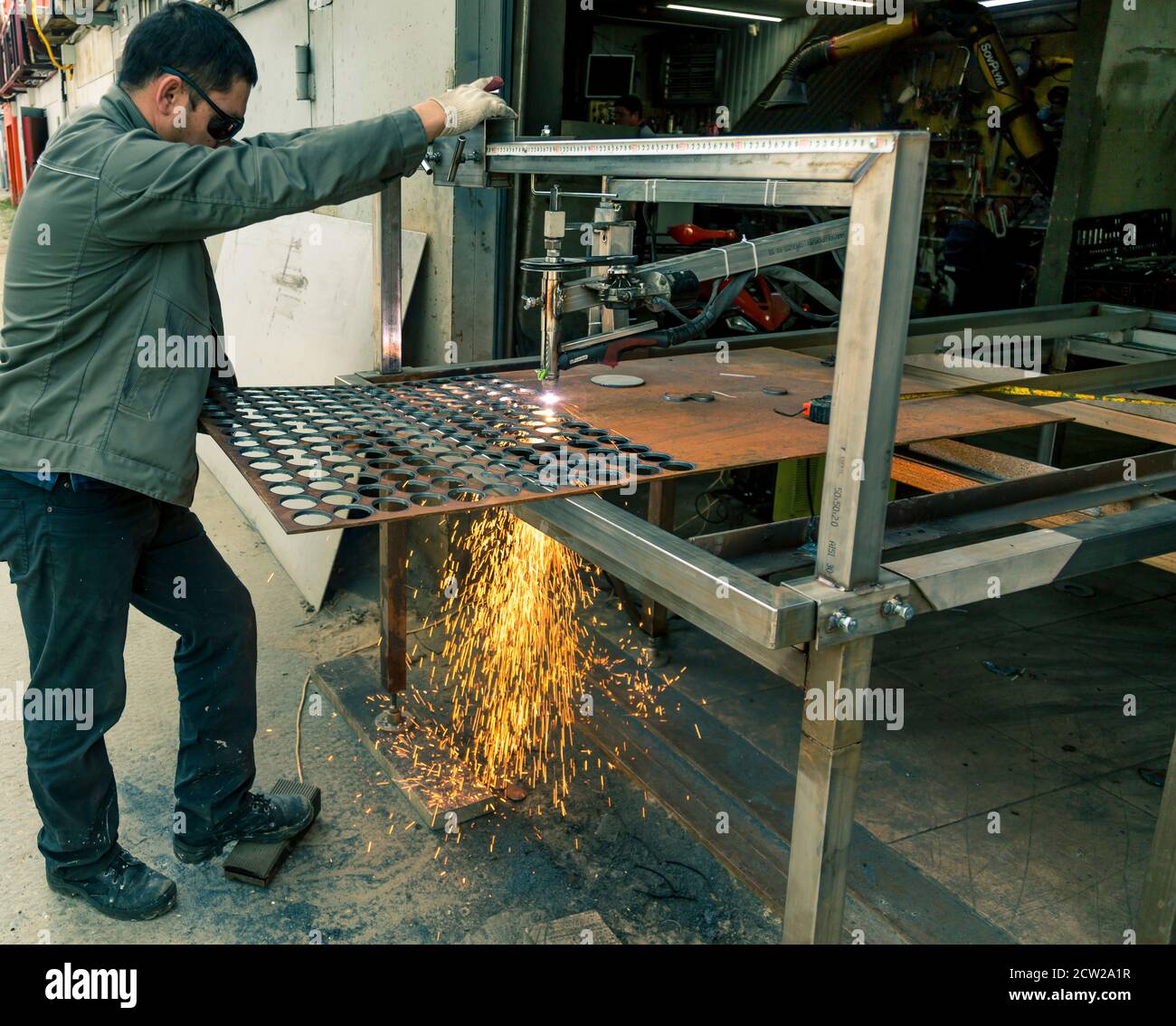 Plasma sheet metal cutting operator on a rack Stock Photo - Alamy