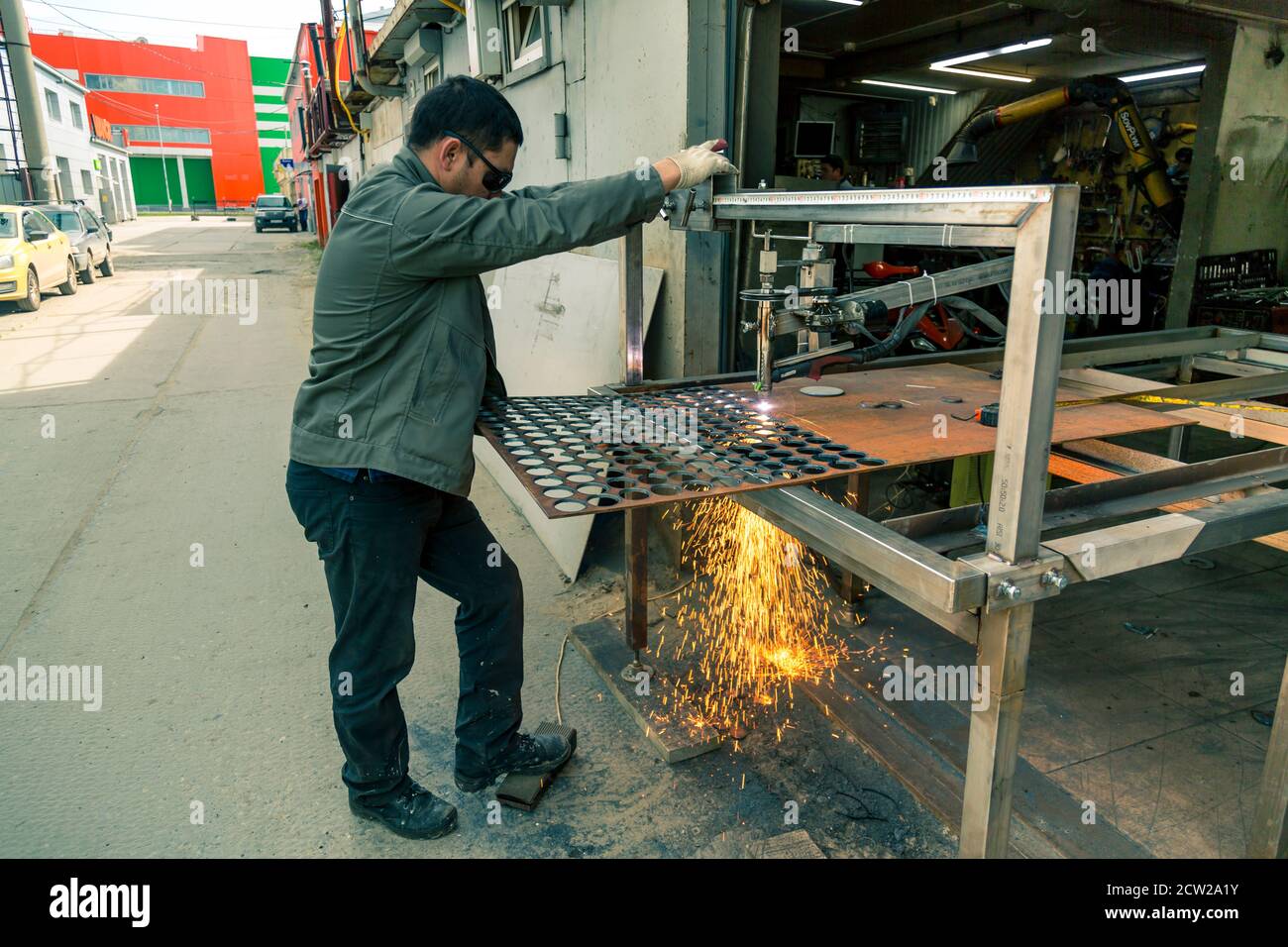 Plasma sheet metal cutting operator on a rack Stock Photo - Alamy