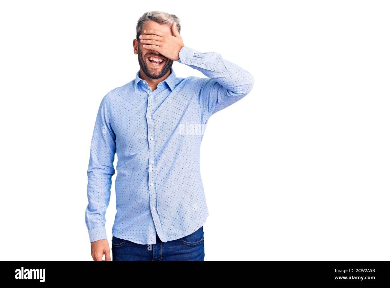 Young handsome blond man wearing elegant shirt smiling and laughing ...