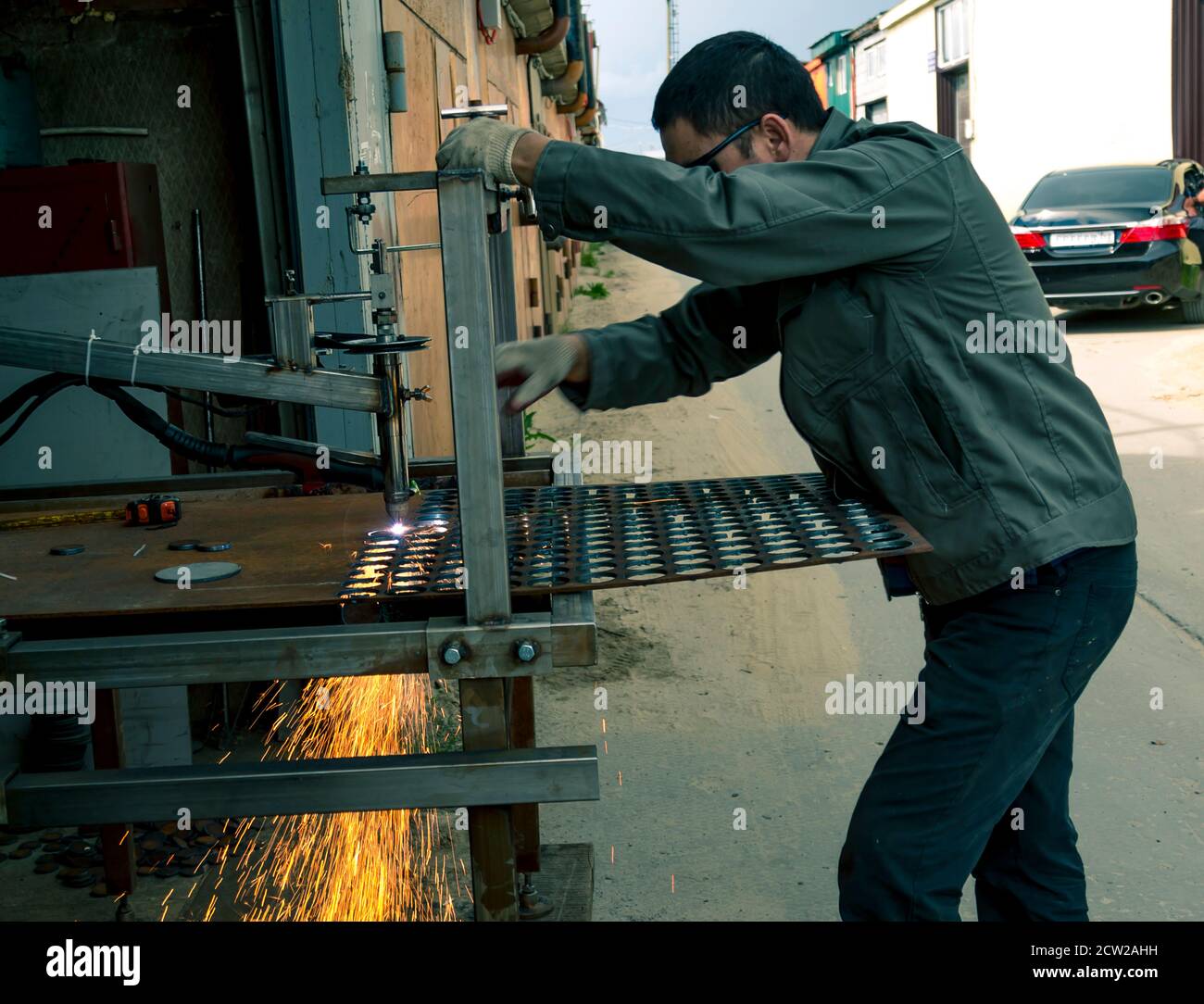 Plasma sheet metal cutting operator on a rack Stock Photo - Alamy
