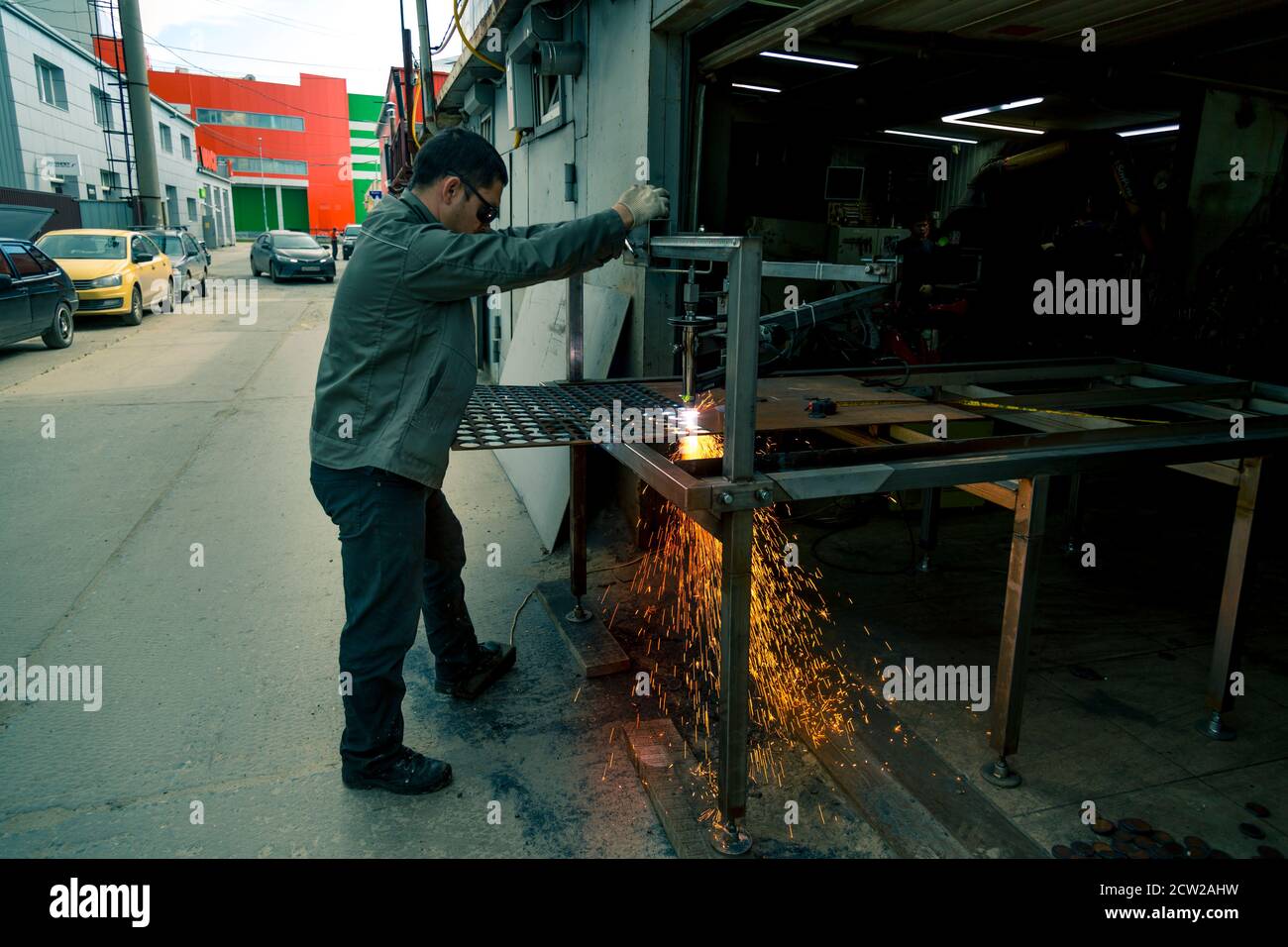 Plasma sheet metal cutting operator on a rack Stock Photo - Alamy