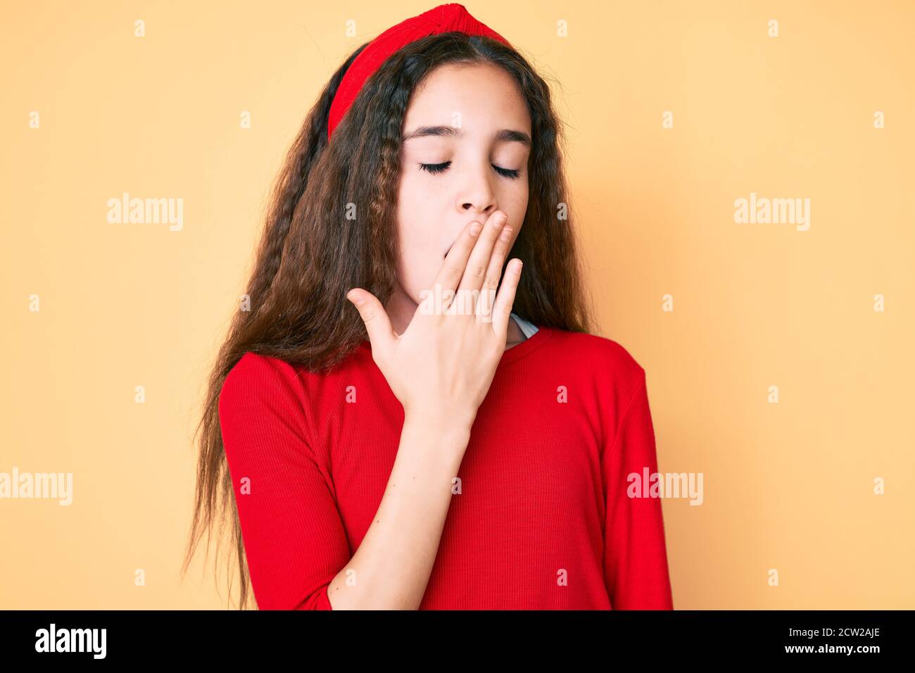 Cute hispanic child girl wearing casual clothes and diadem bored ...