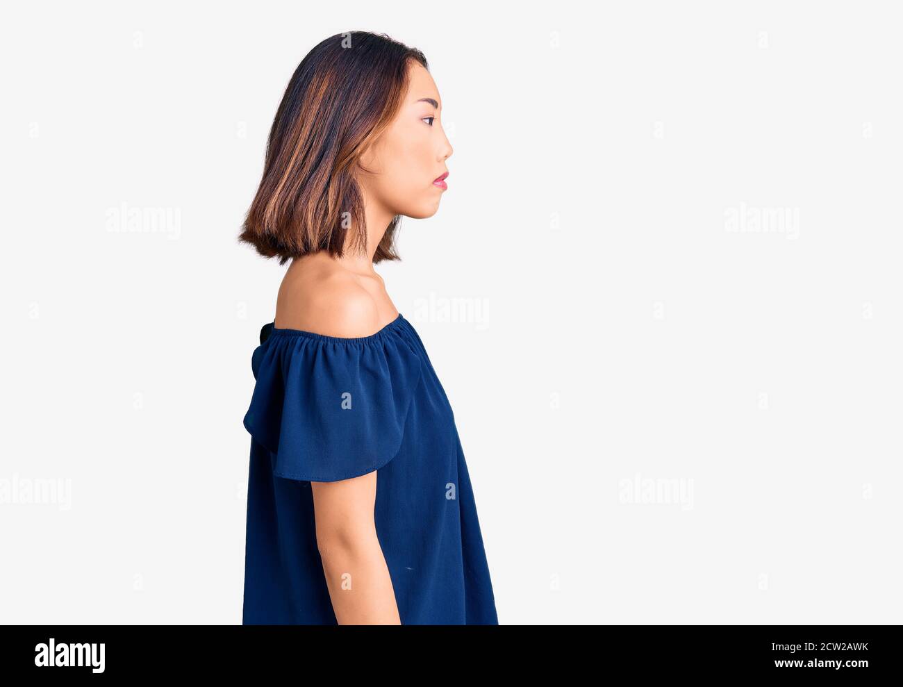 Young beautiful chinese girl wearing casual clothes looking to side ...