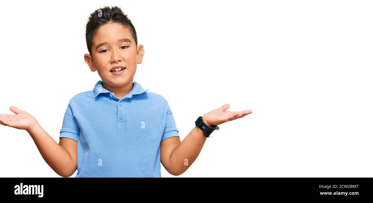 Little boy hispanic kid wearing casual clothes smiling cheerful ...