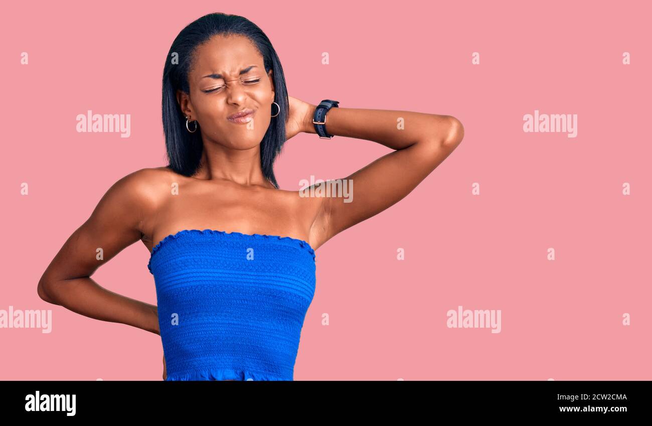 Young african american woman wearing casual summer clothes suffering of ...
