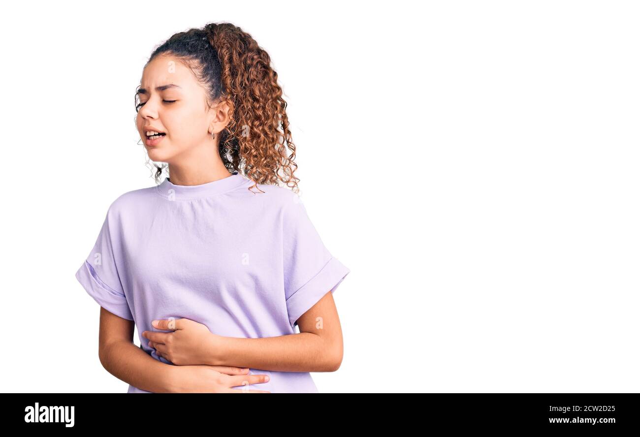 Beautiful kid girl with curly hair wearing casual clothes with hand on ...