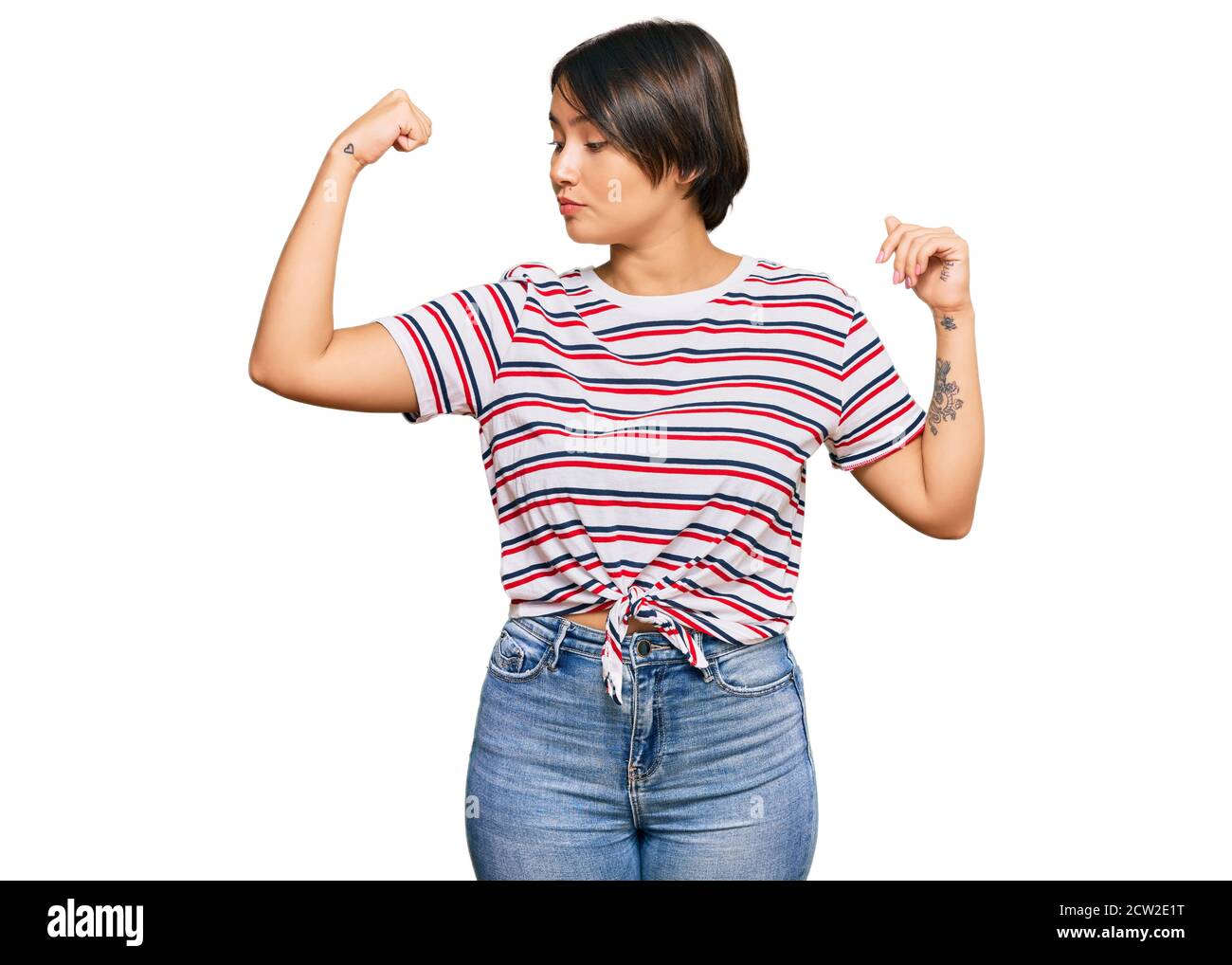 Beautiful young woman with short hair wearing casual clothes showing ...