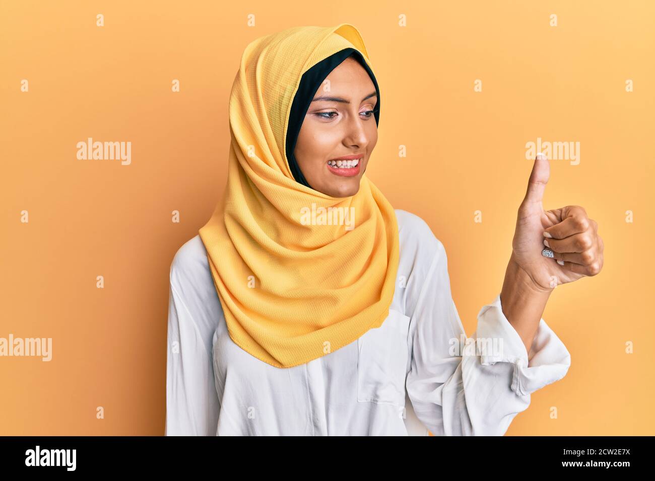 Young brunette arab woman wearing traditional islamic hijab scarf ...