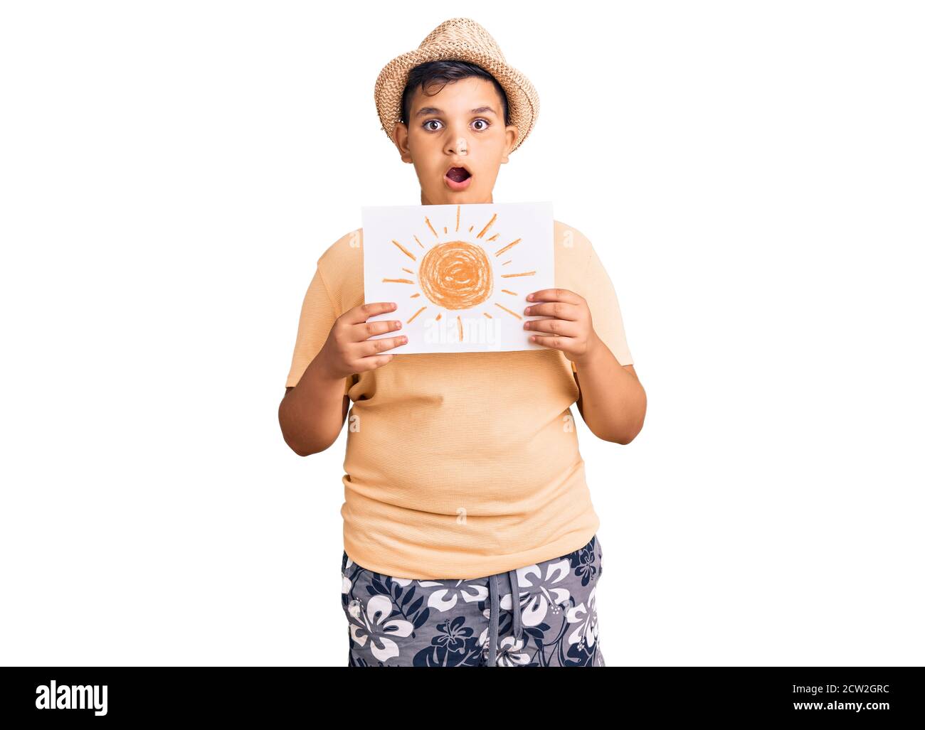 Little boy kid holding sun draw scared and amazed with open mouth for ...