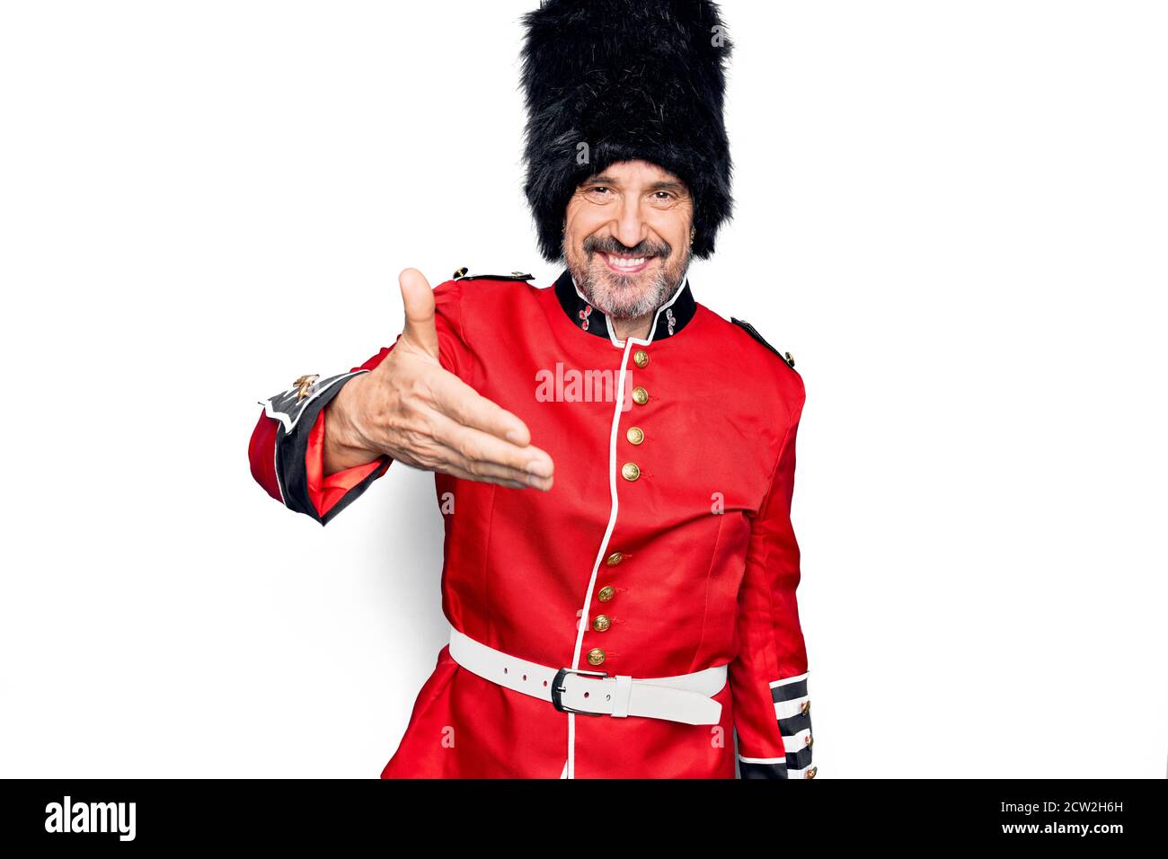 Middle age handsome wales guard man wearing traditional uniform over ...