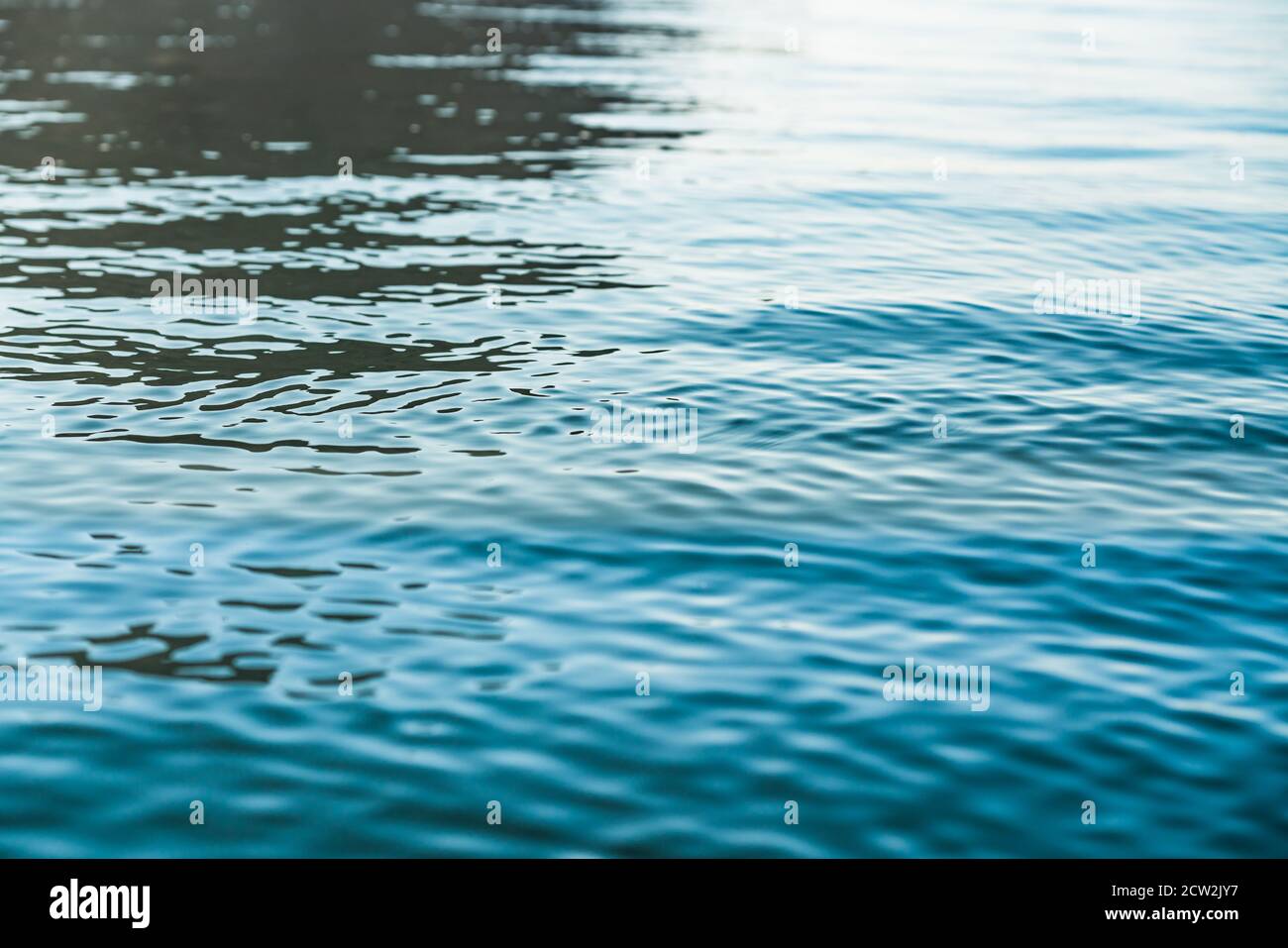 Water surface background. Quiet sea with beautiful sun reflections ...
