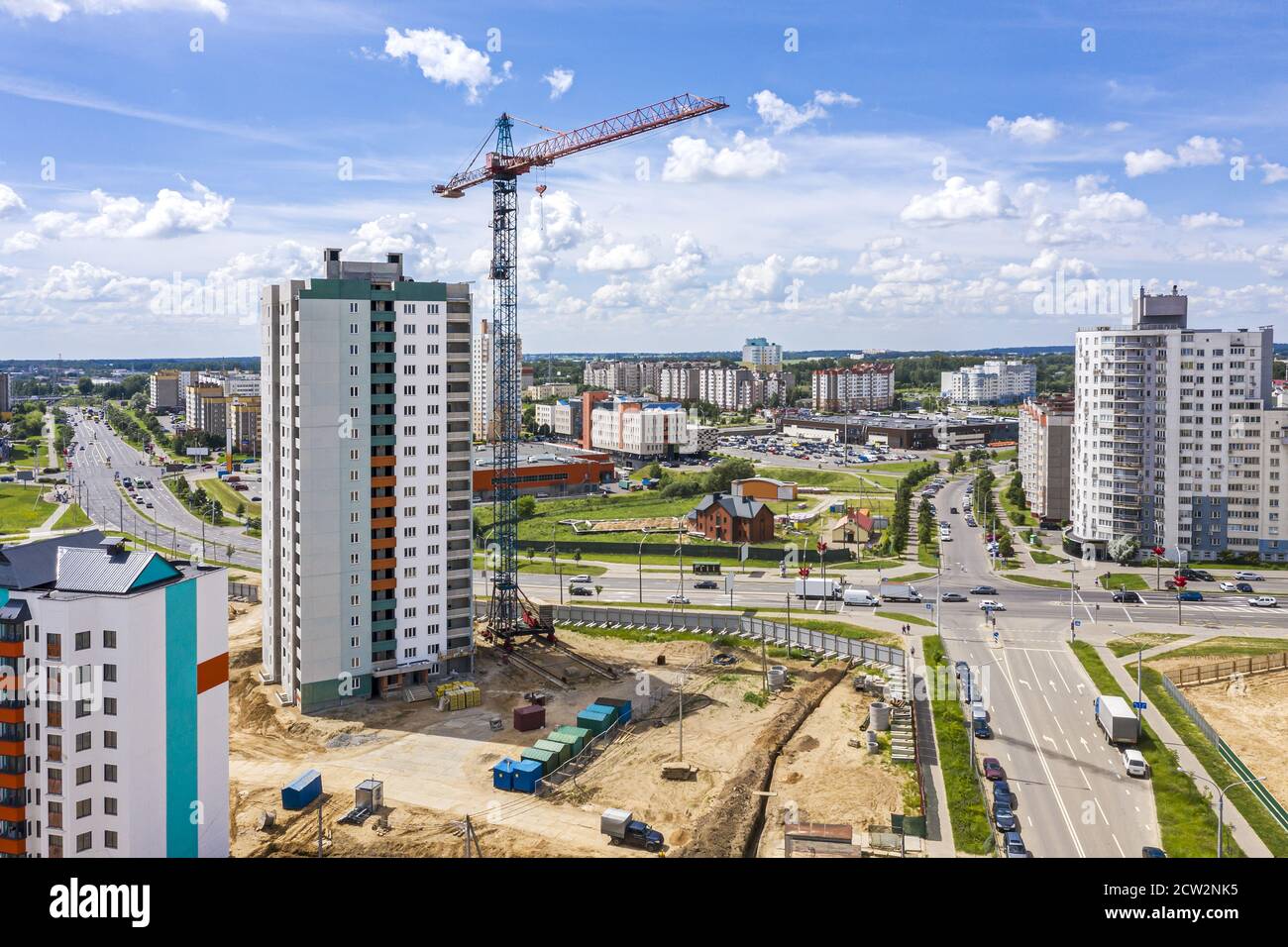 construction site with high-rise buildings and crane on blue sky ...