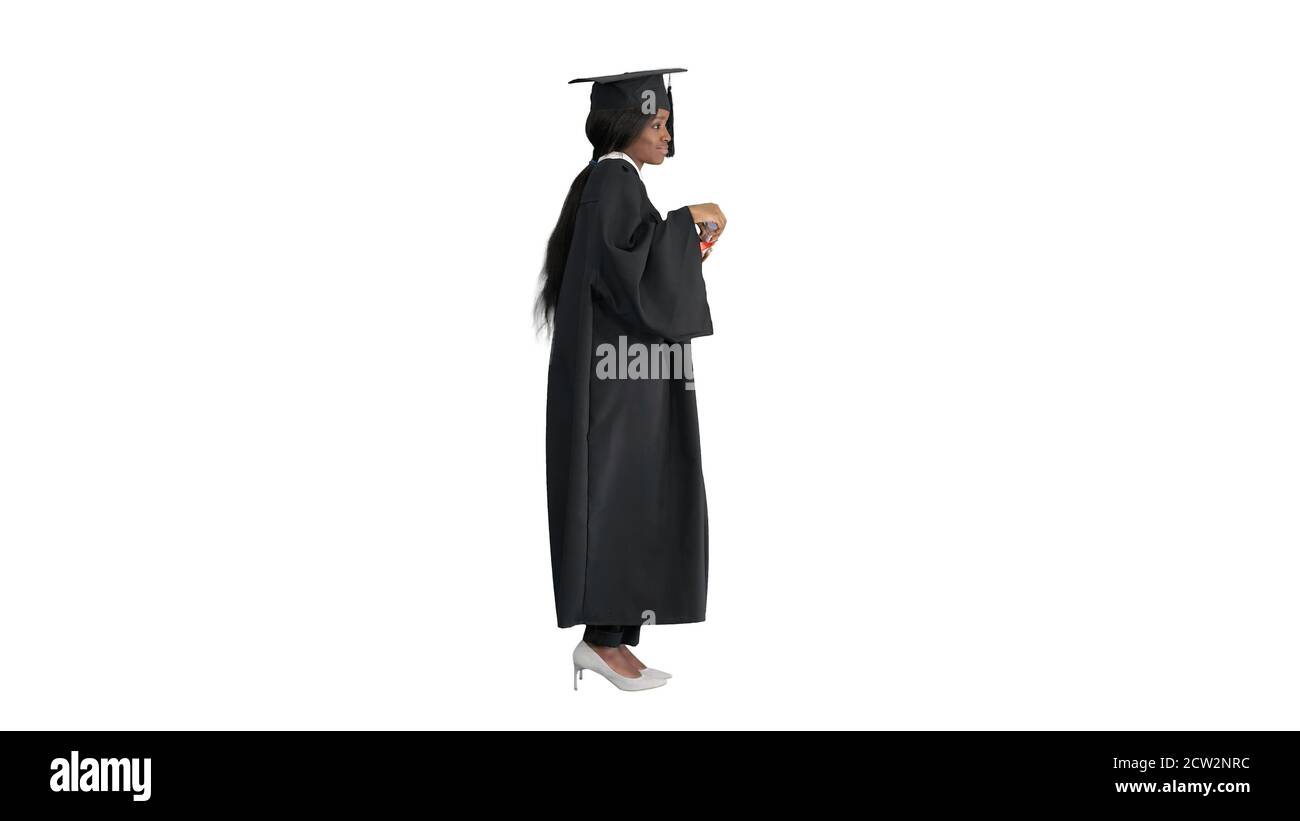 Happy African American female graduate dancing with her diploma Stock ...