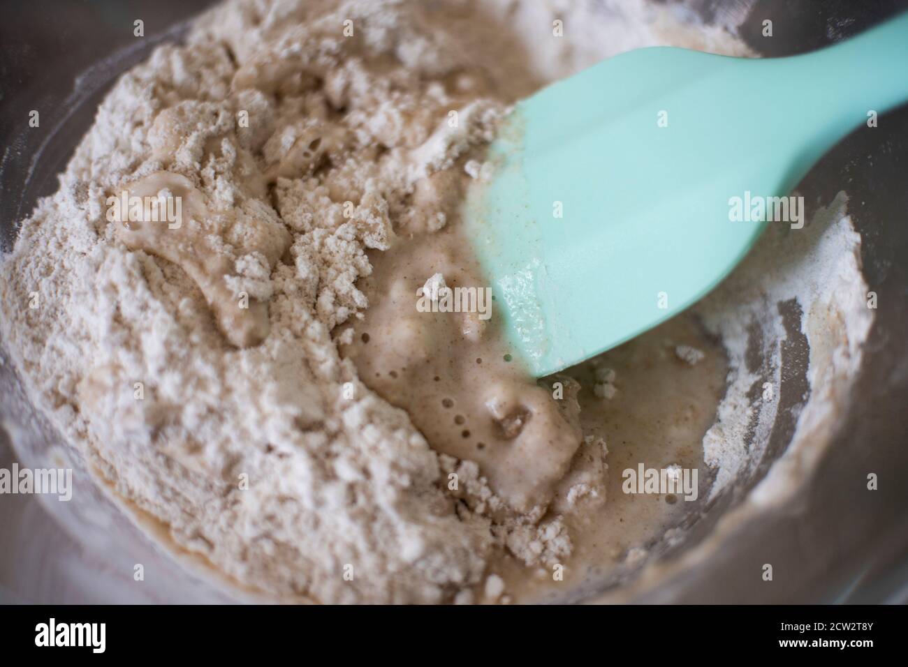 mixing and stirring rye flour with water Stock Photo - Alamy