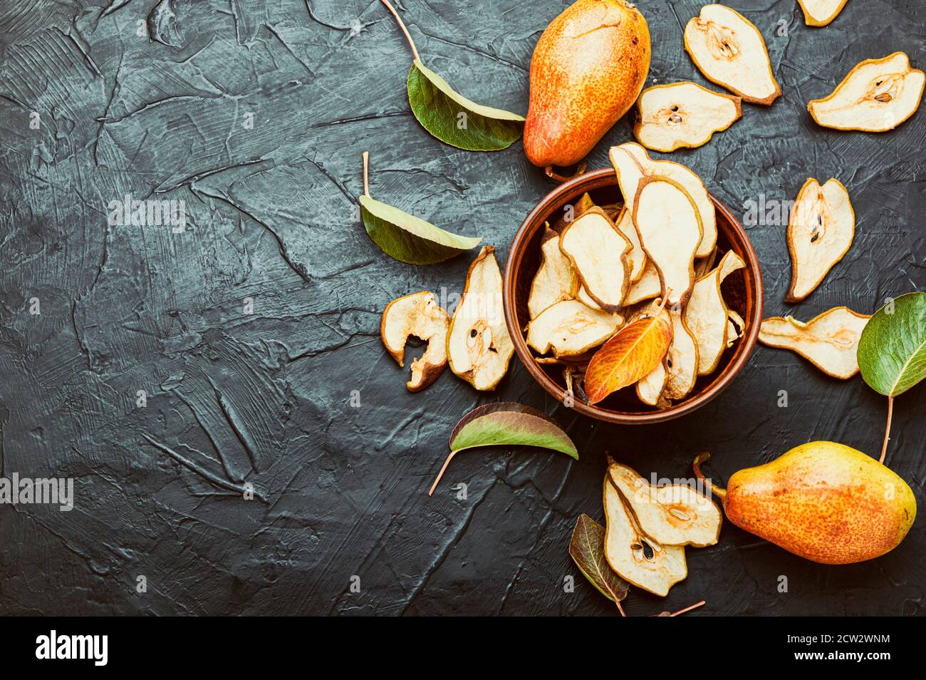 Sliced dried pear pieces.Dried pear or pear chips.Dried fruits.Copy ...