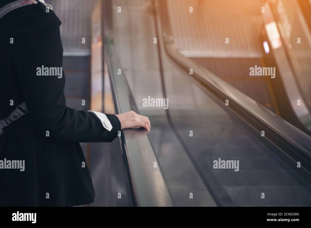 Airport travelator woman hi-res stock photography and images - Alamy