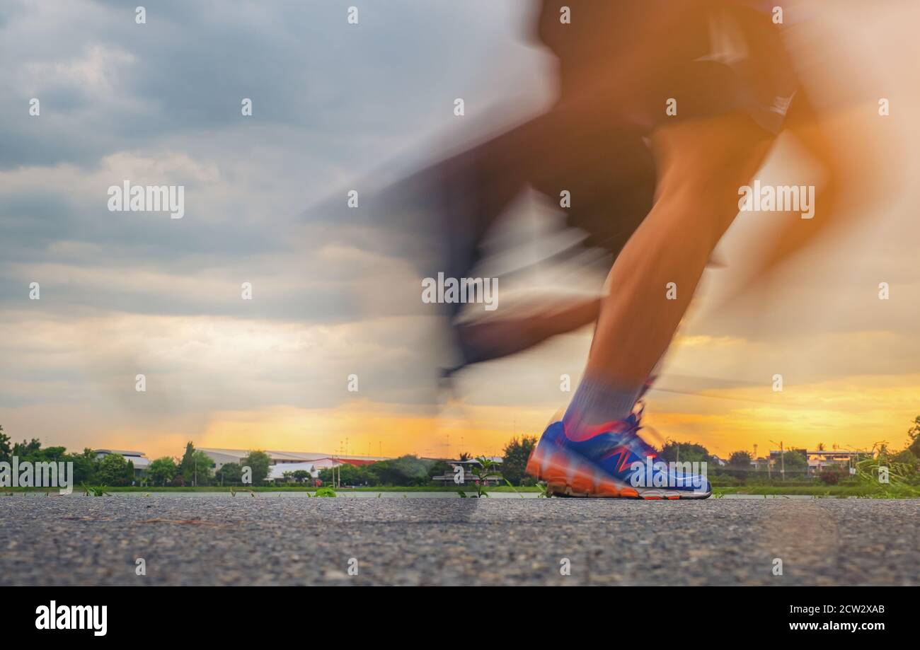 Runner's Feet, Motion Blurred runner closeup shot runner running at a ...