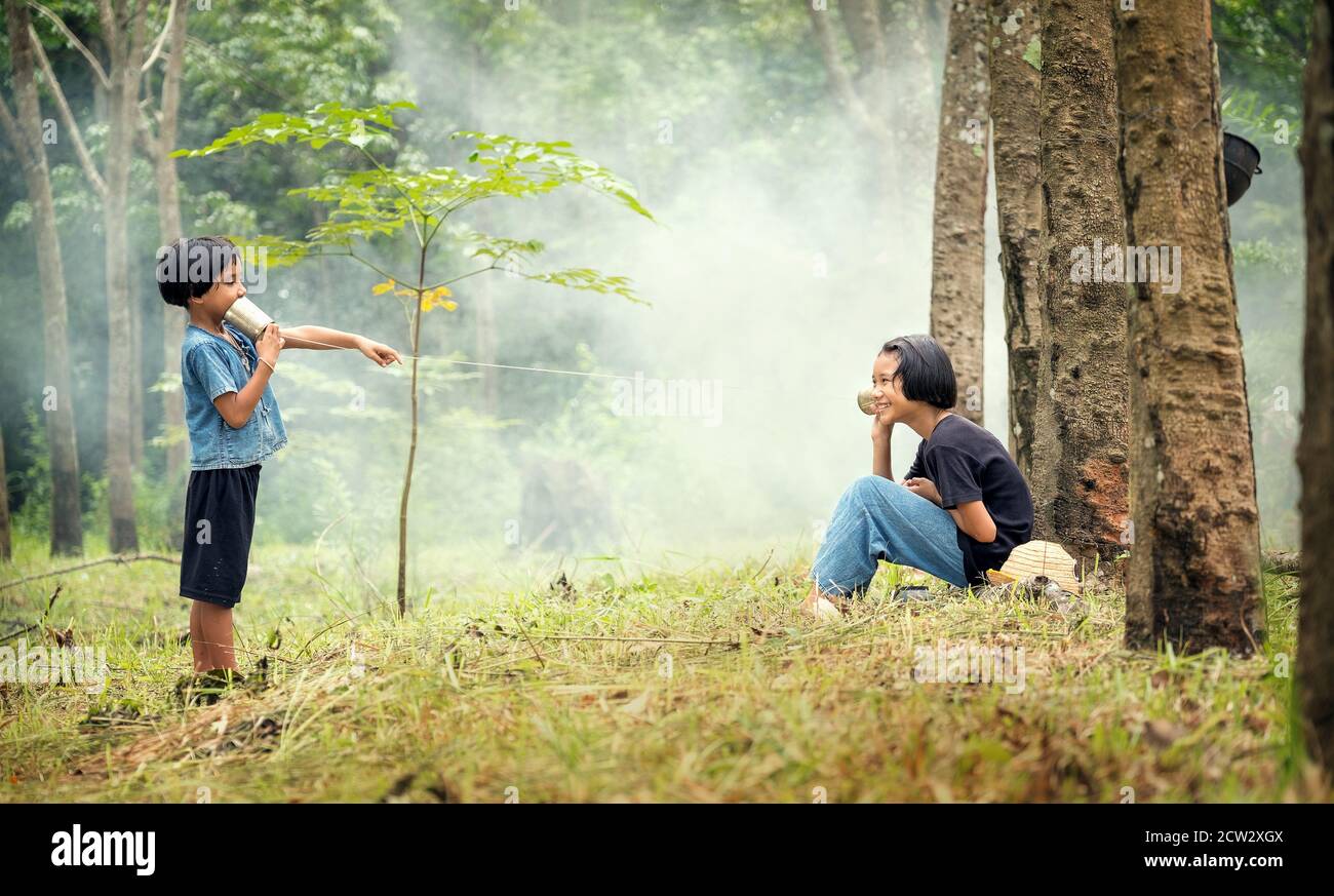 Asian Rural children girl talking communicate with can phone.The joy of ...
