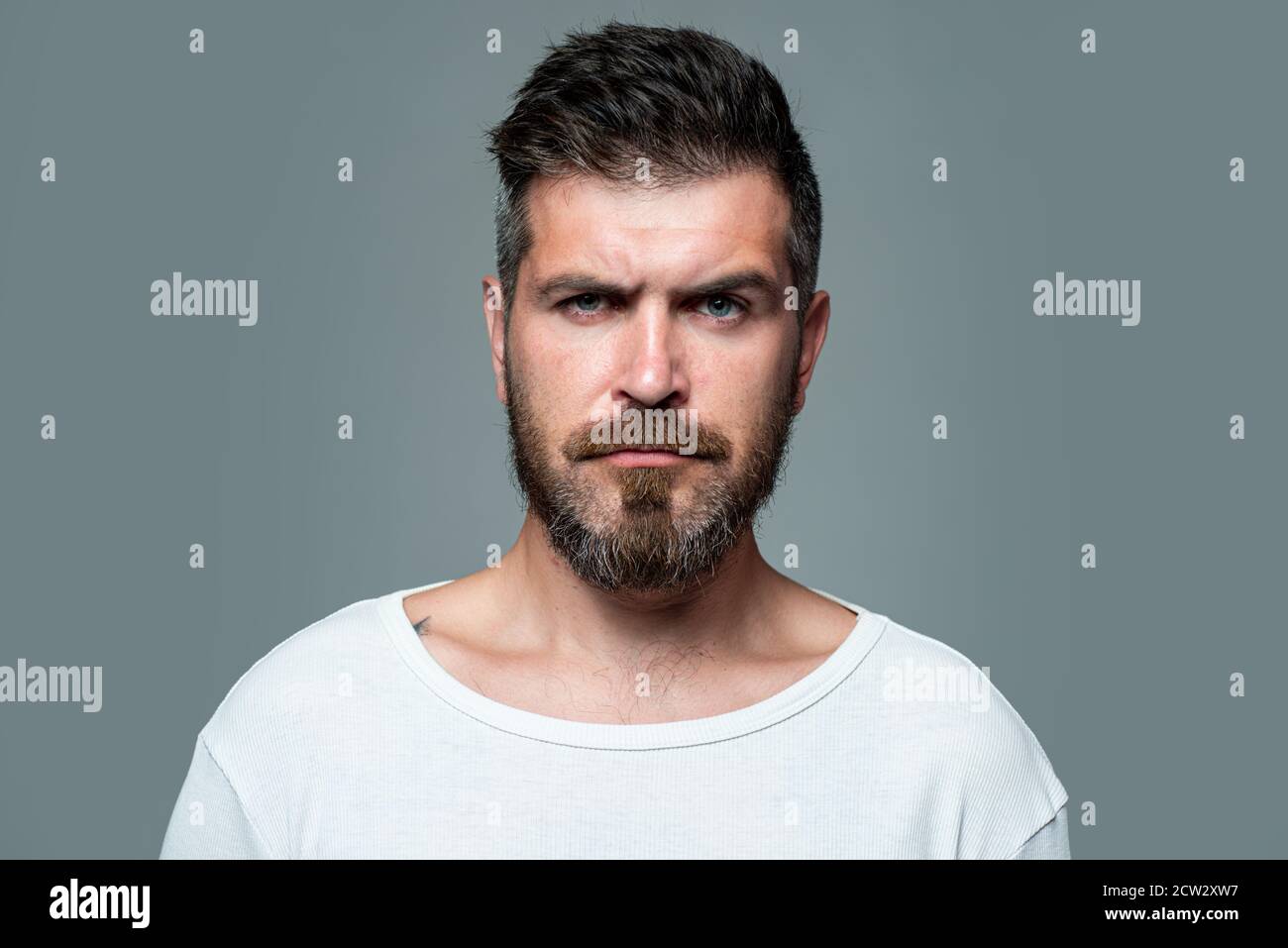 Hipster man models in studio. Businessman thinking with expression ...