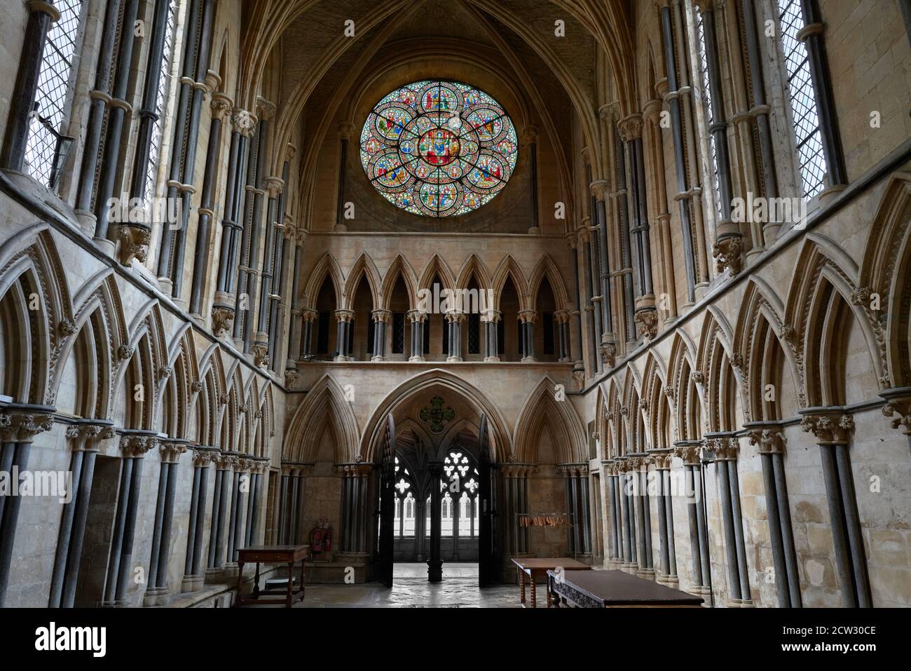A rose stained glass window above the exit to the thirteenth century ...